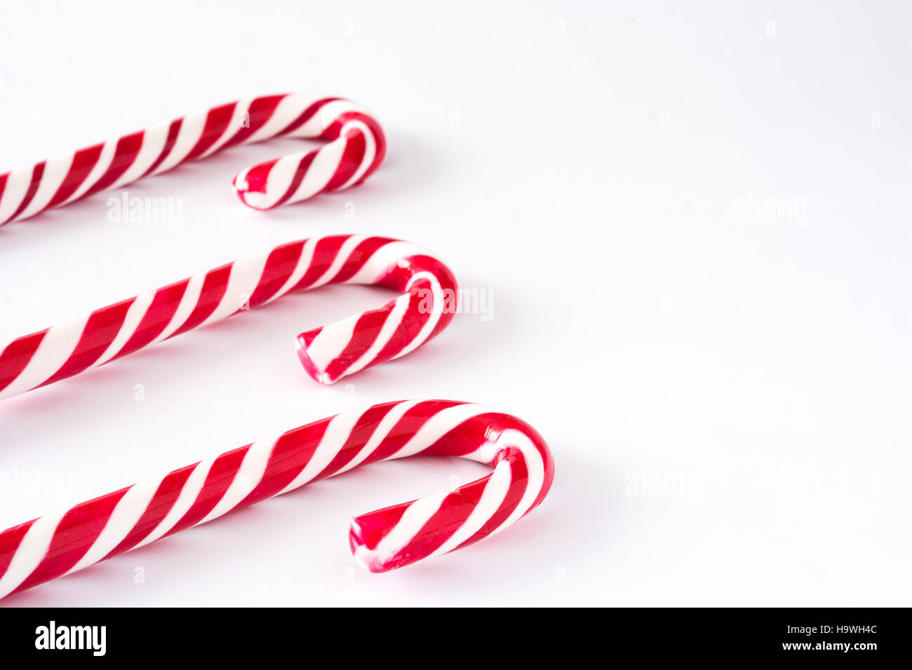 Candy canes isolated on white background Stock Photo - Alamy