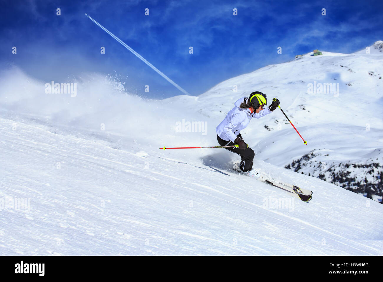A female ski driver on the piste in Alps by Lech, Austria Stock Photo ...