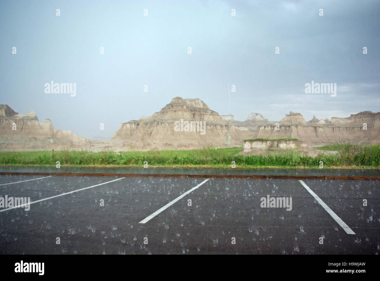 This image from Badlands National Park depicts a rainstorm, showcasing ...