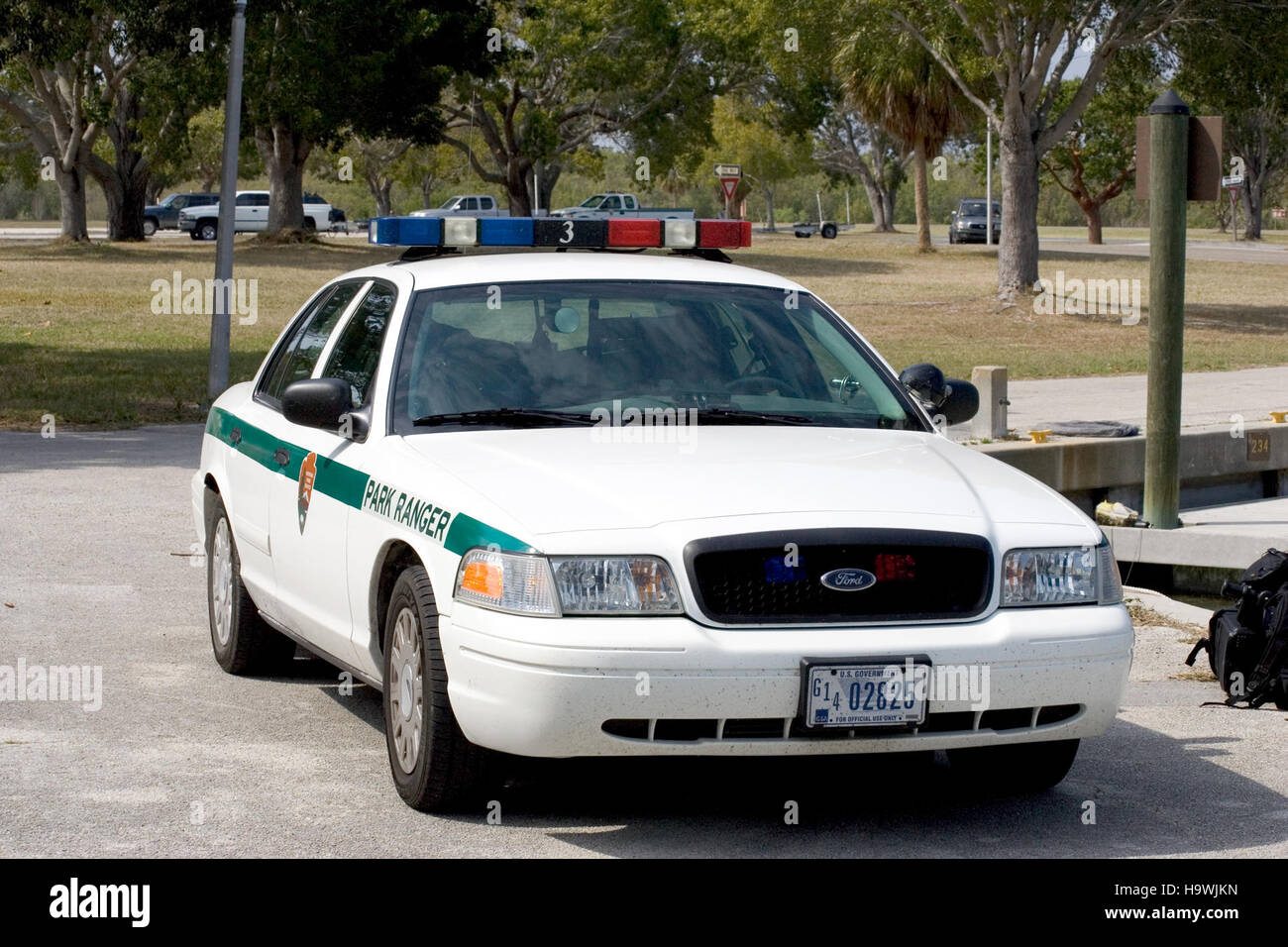This image shows a ranger from Everglades National Park protecting ...