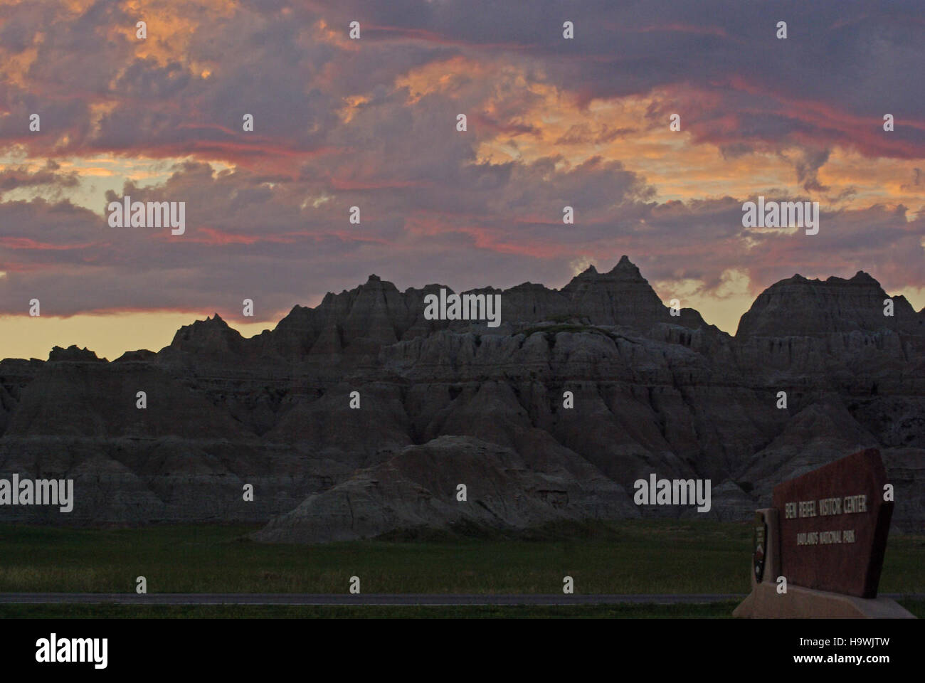 A stunning sunset over the Badlands National Park, showcasing the ...