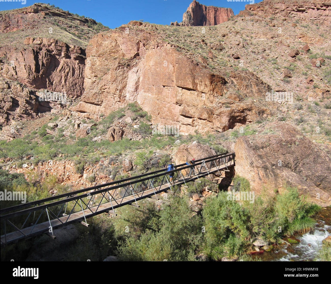 The image captures the Ribbon Falls Bridge along the North Kaibab Trail ...