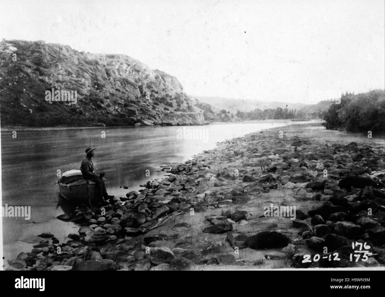 A historic photo capturing the Colorado River within the Grand Canyon ...
