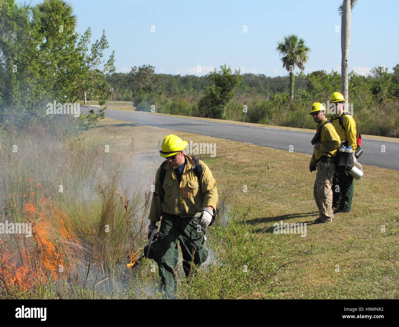 A prescribed fire near structures in Everglades National Park is used ...