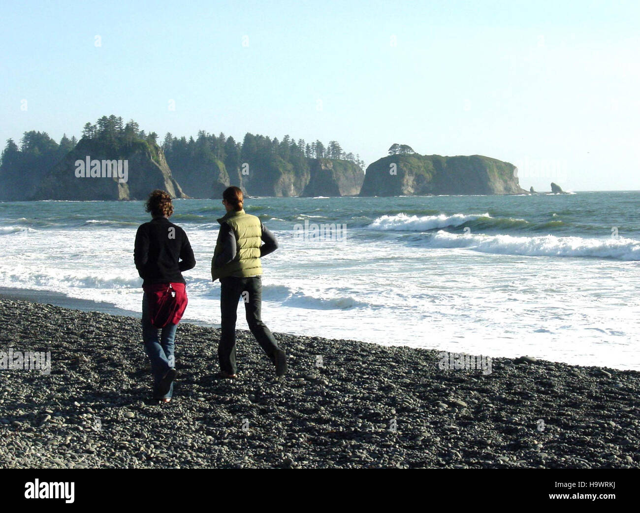 A photo of visitors walking along Rialto Beach in Olympic National Park ...