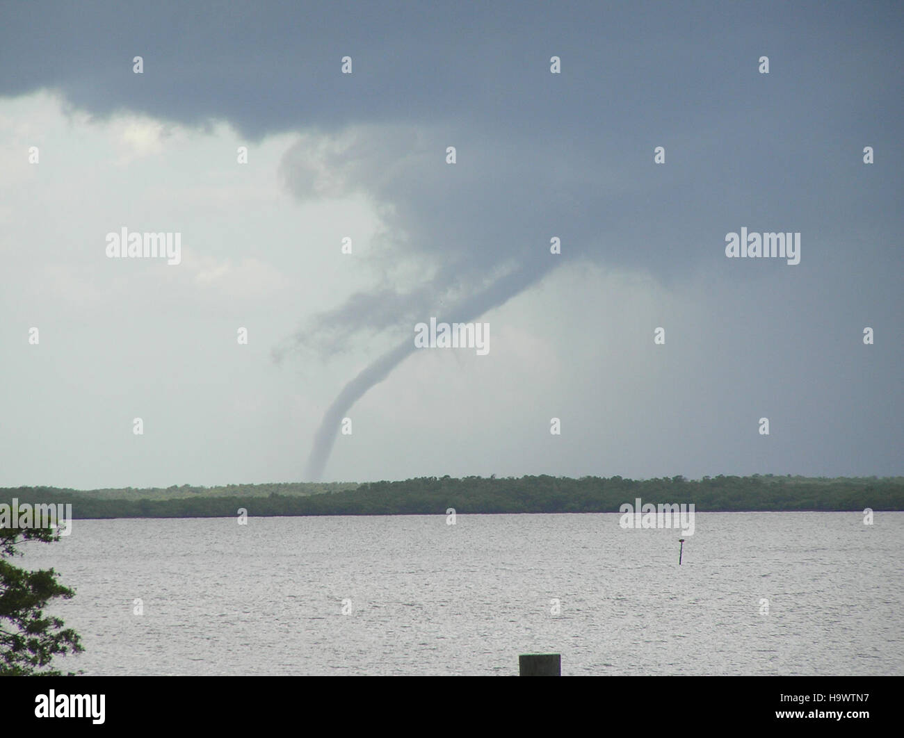 A waterspout forms over the waters of Everglades National Park ...