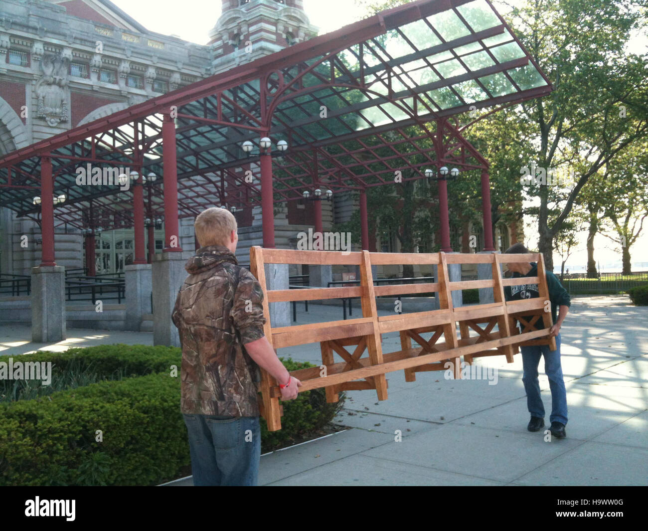 This image shows a historic scene at Ellis Island, a key site for ...