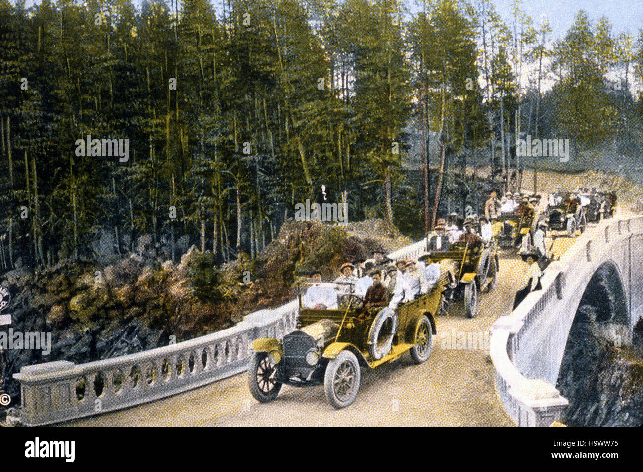 Yellowstone National Park’s iconic yellow buses are seen crossing ...
