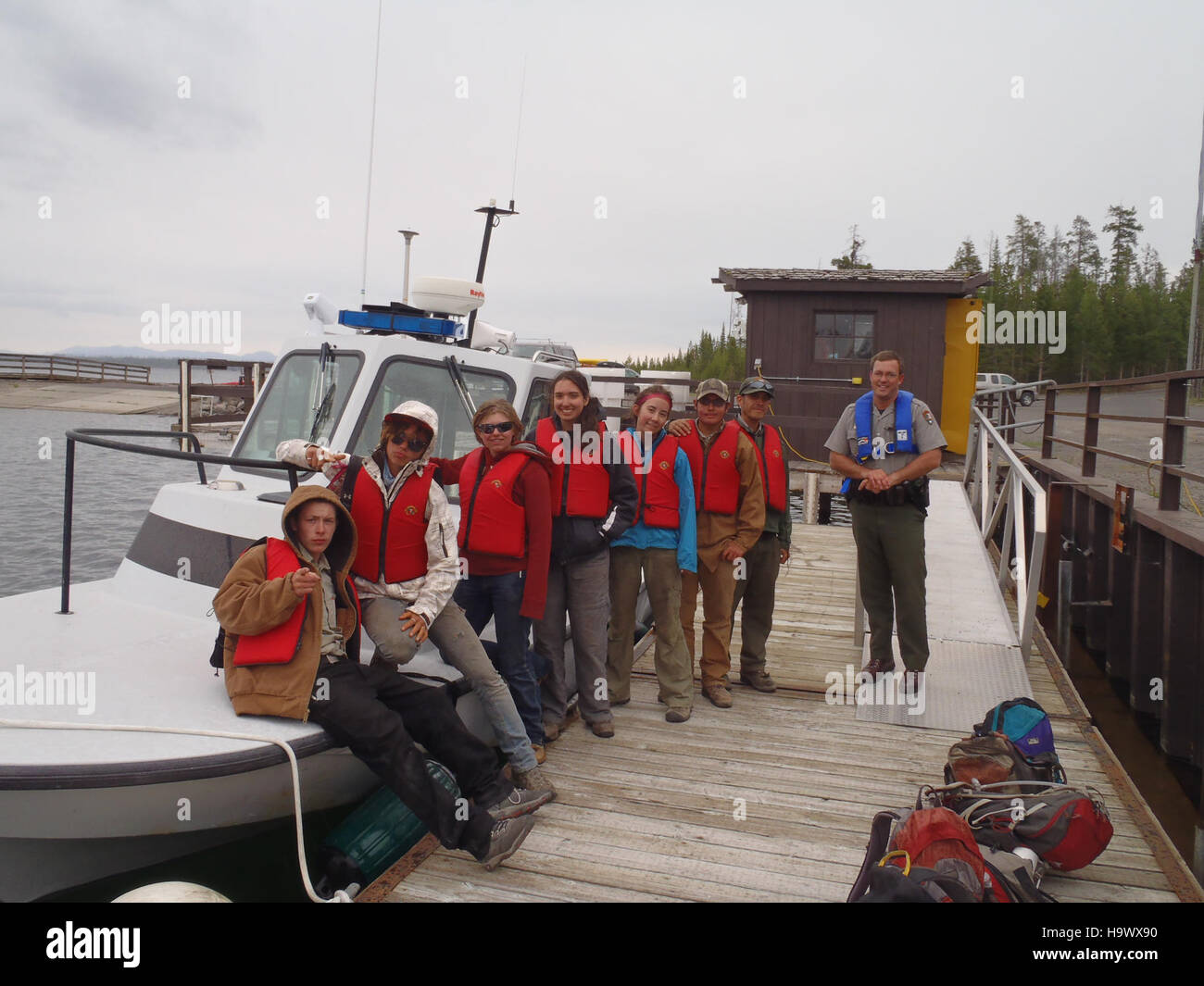 This image features a group of Youth Conservation Corps members working ...