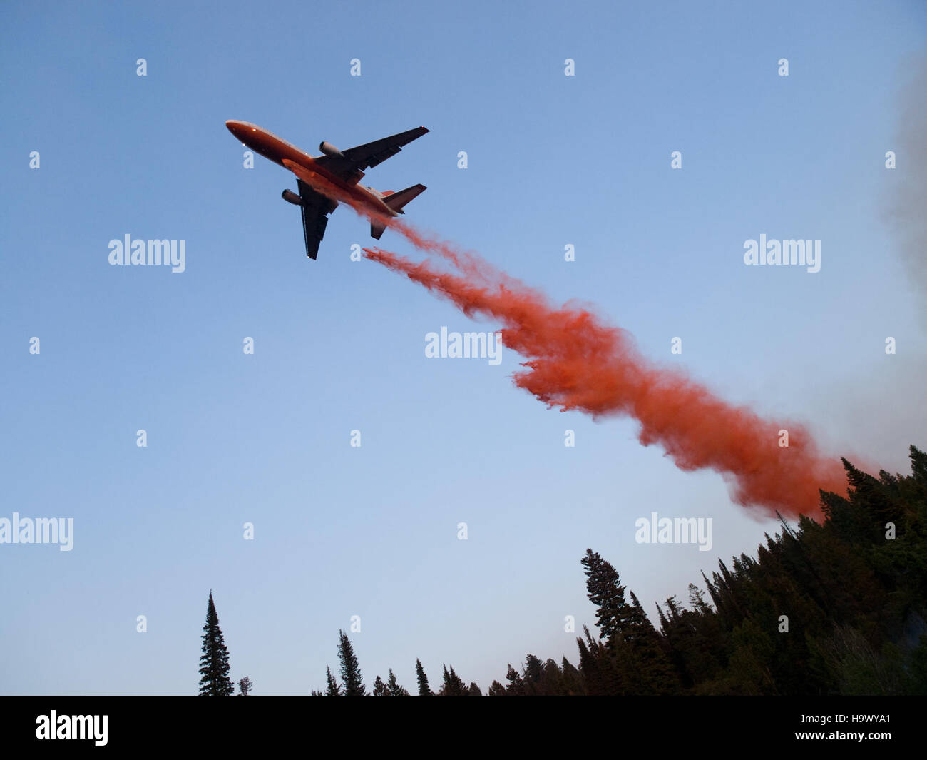 An image from August 2012 showing an airtanker releasing fire retardant ...
