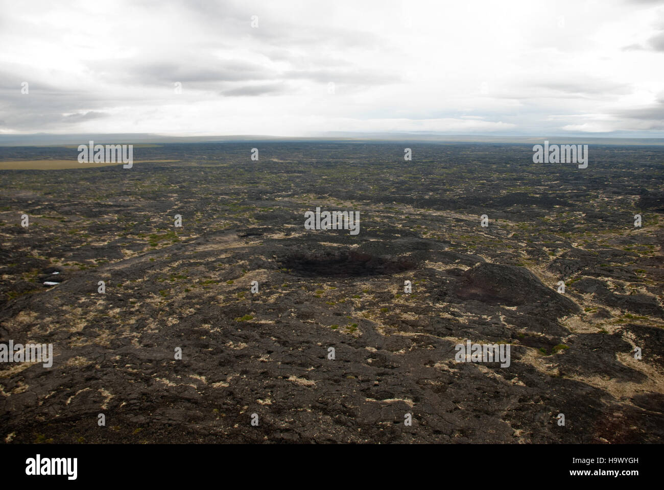 The Bering Land Bridge, shown with ancient lava vents, represents a ...
