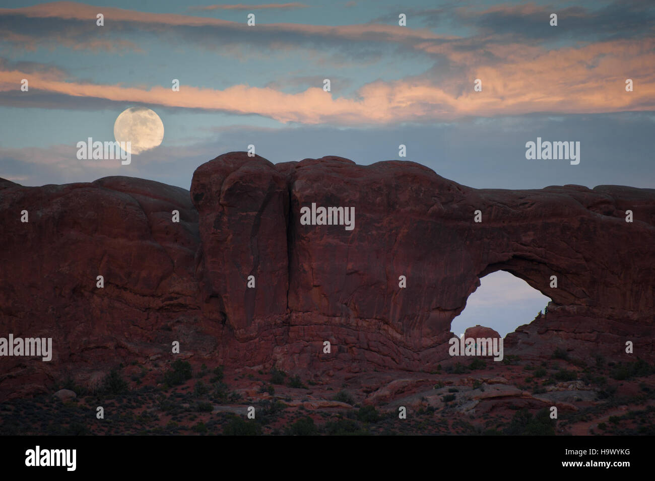 A photograph capturing the waxing moon through the North Window arch in ...