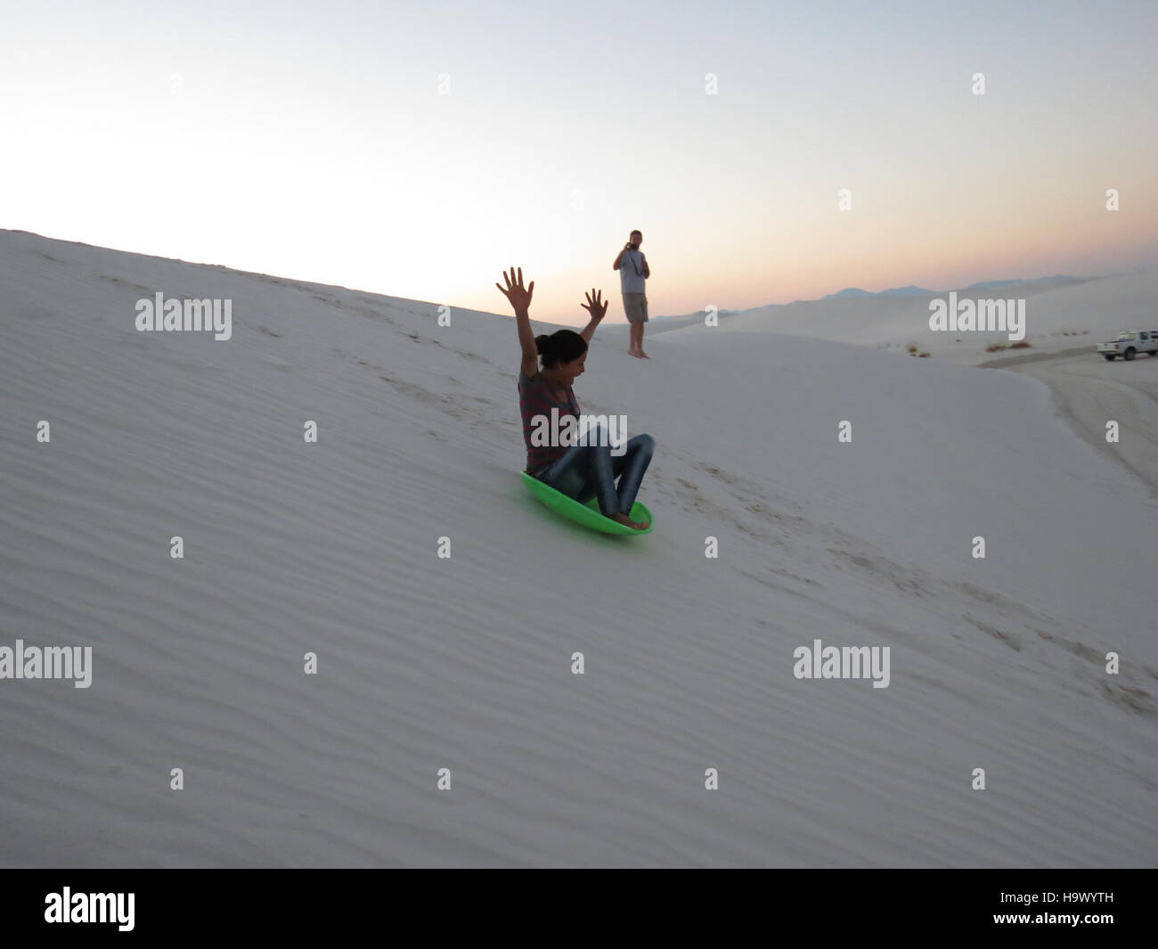 This photograph captures a thrilling ride on a roller coaster, as seen ...
