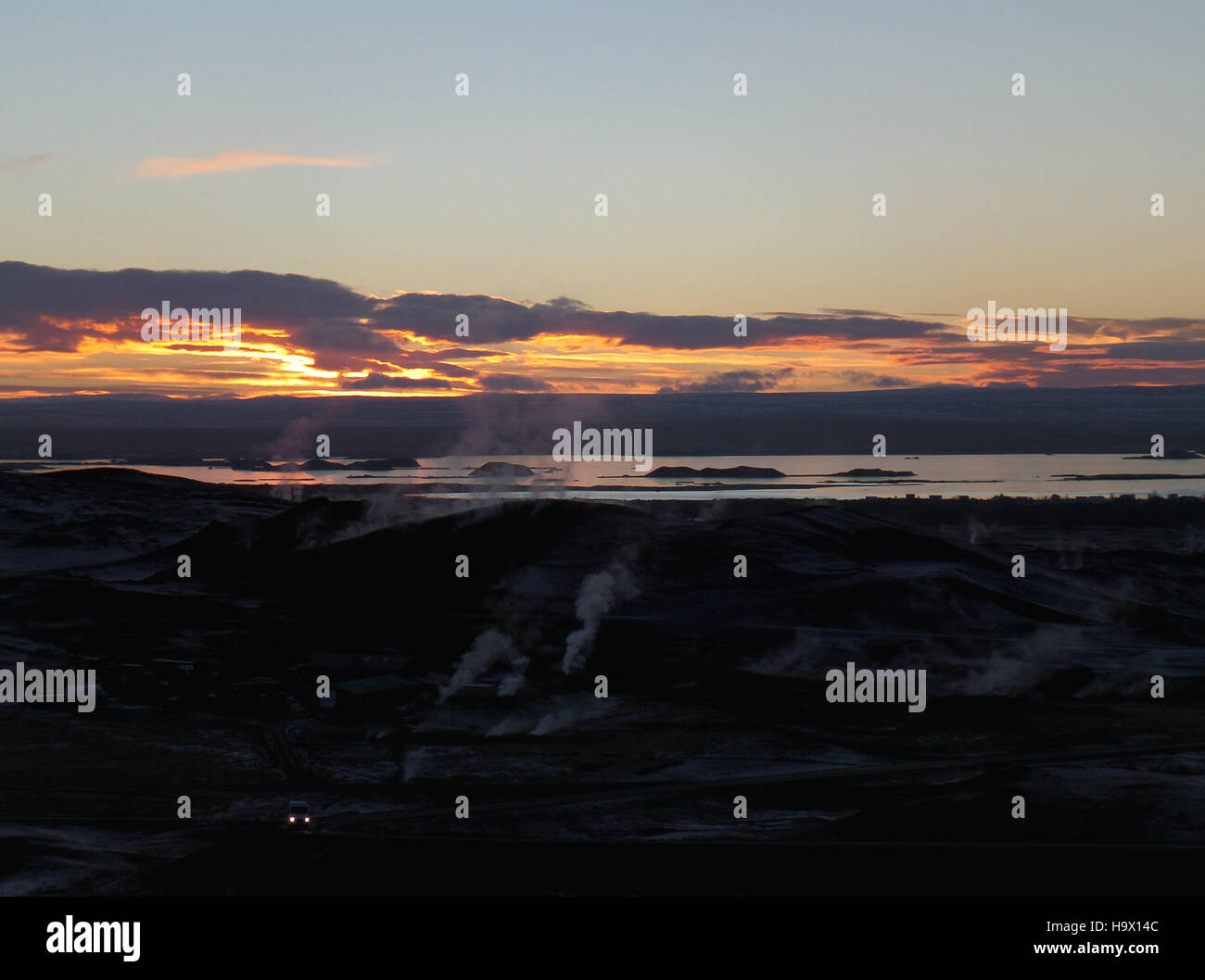 Afterglow of sunset over the geothermal area and the lake of Myvatn ...