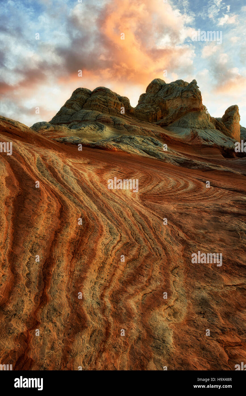 Sunset glow on one of the many swirling sandstone formations in Arizona ...
