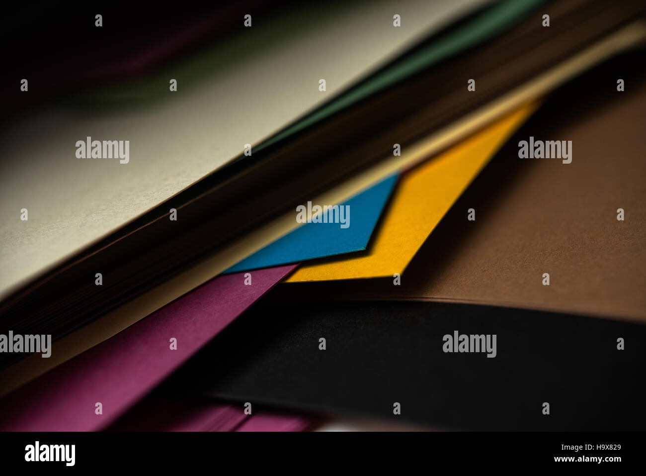 CMYK Paper stack in printshop Stock Photo - Alamy
