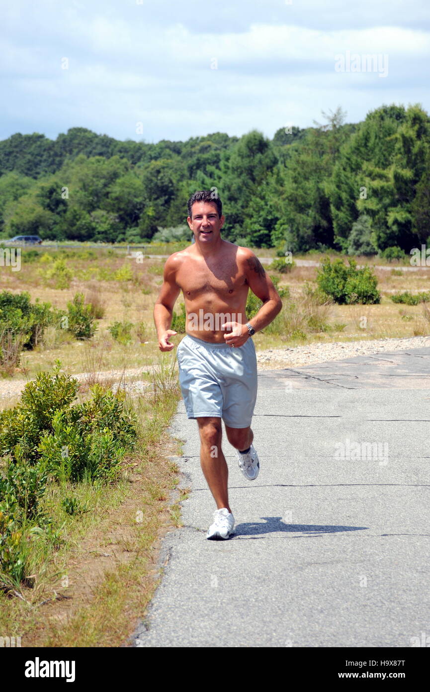 Handsome runner on trail Stock Photo - Alamy
