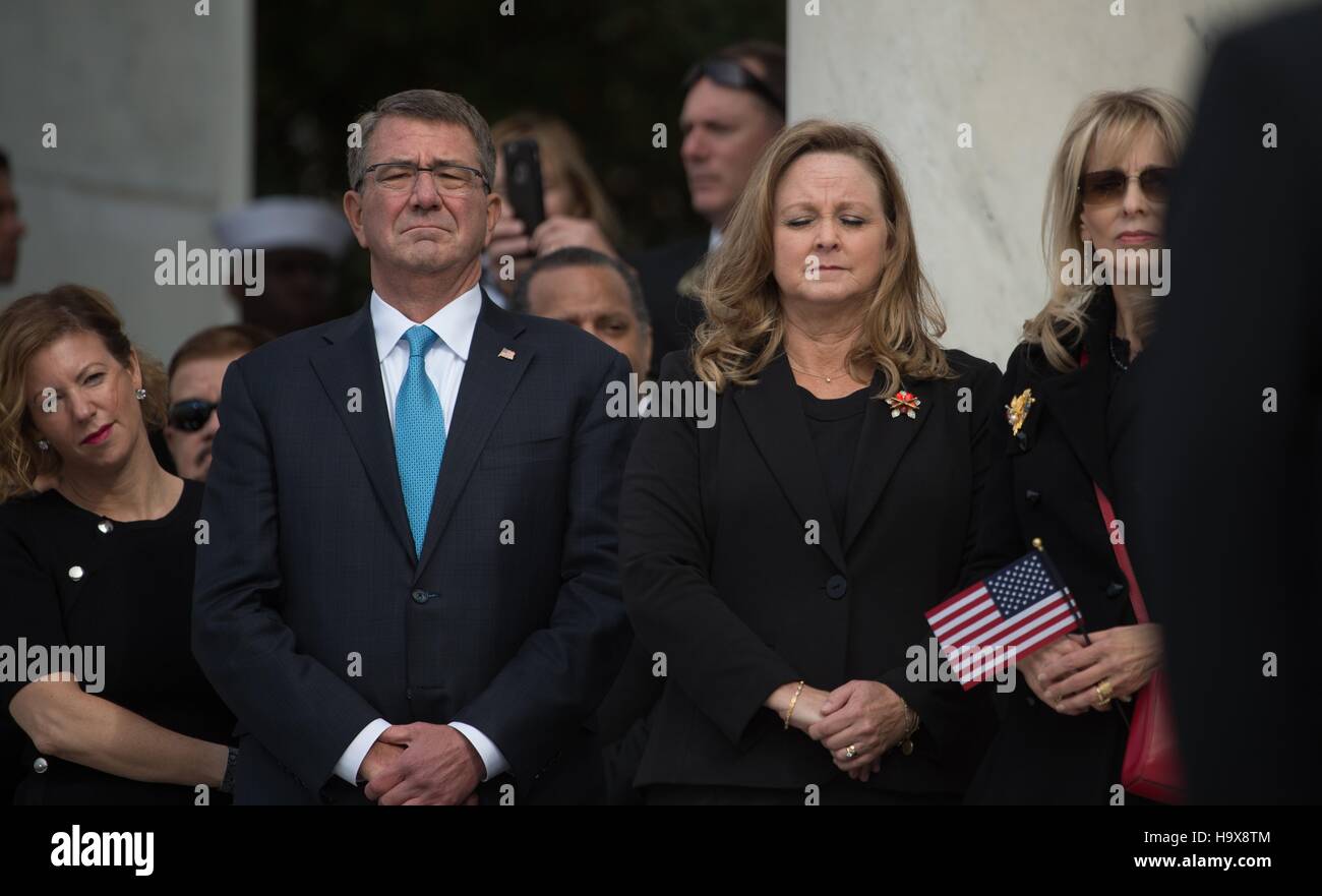 U.S. Secretary of Defense Ash Carter observes a moment of silence ...