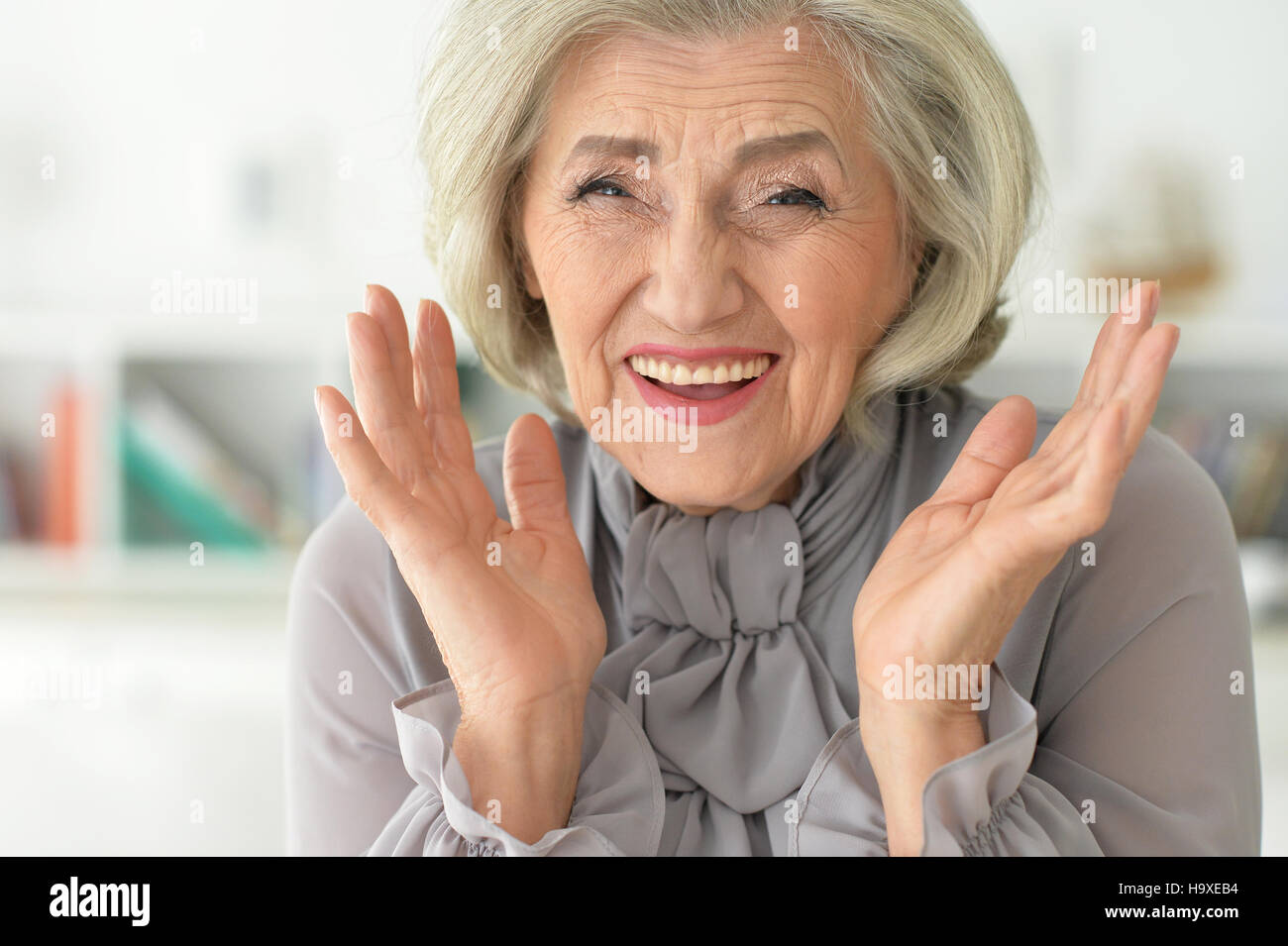 Exited senior woman Stock Photo - Alamy