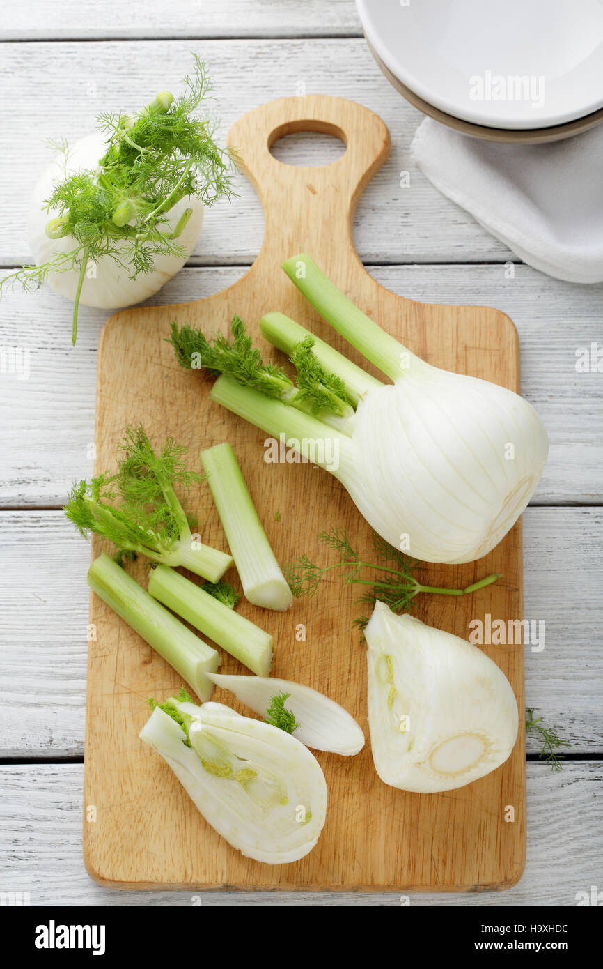 Fresh fennel cutting on board, food above Stock Photo - Alamy