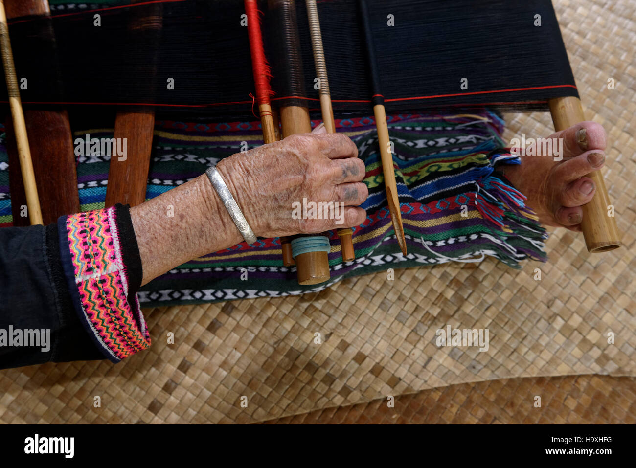 weaving in the Village Binlang of Li and Miao minorities near Sanya ...
