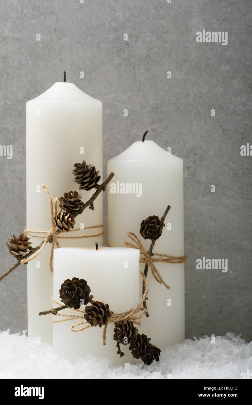 White christmas candles, holiday decorations Stock Photo - Alamy