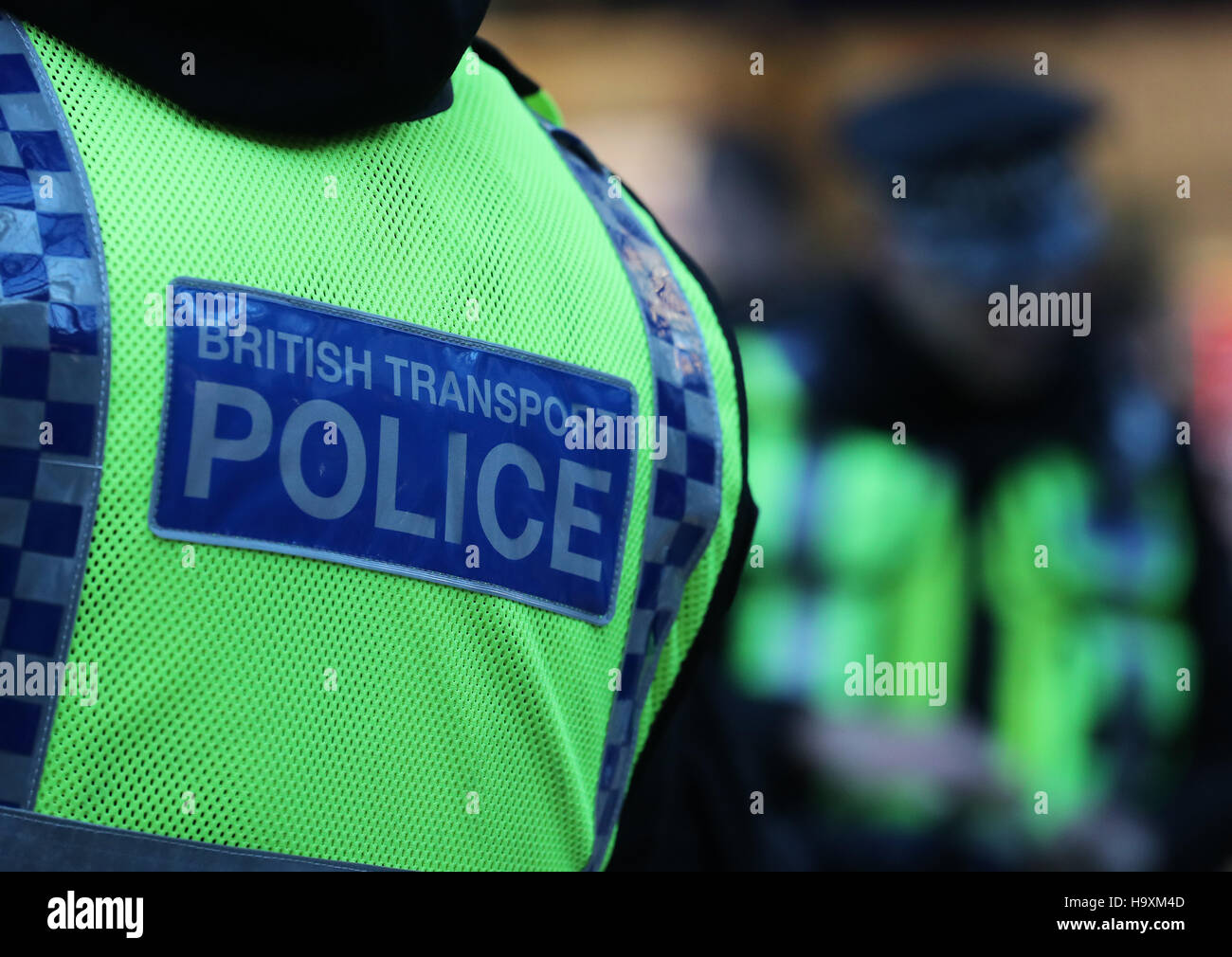 British transport Police officers hand out leaflets to members of the ...