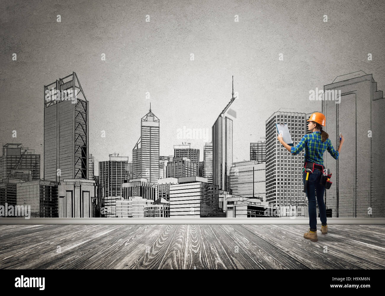 Back view of engineer woman with folder and sketches of construction ...