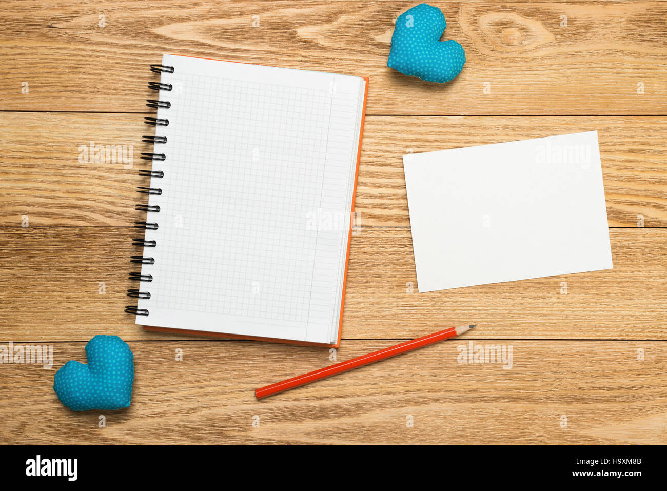Blank paper sheet for writing on wooden table Stock Photo - Alamy