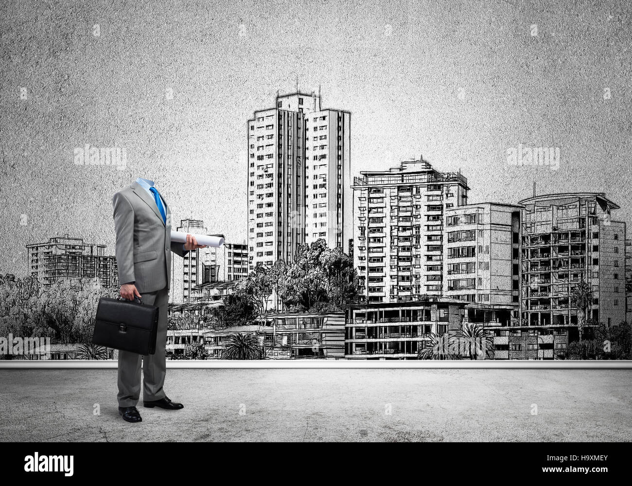 Headless engineer man with papers in hand against construction ...