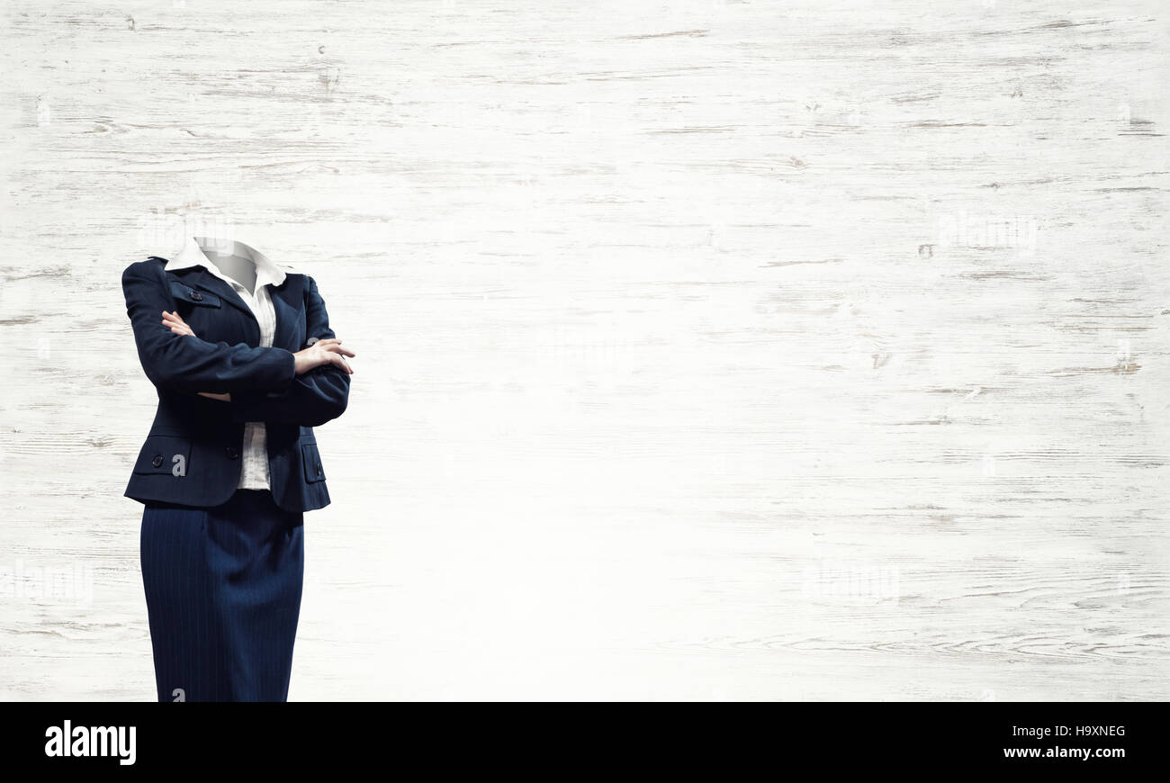 Headless businesswoman with arms crossed on chest on gray background ...