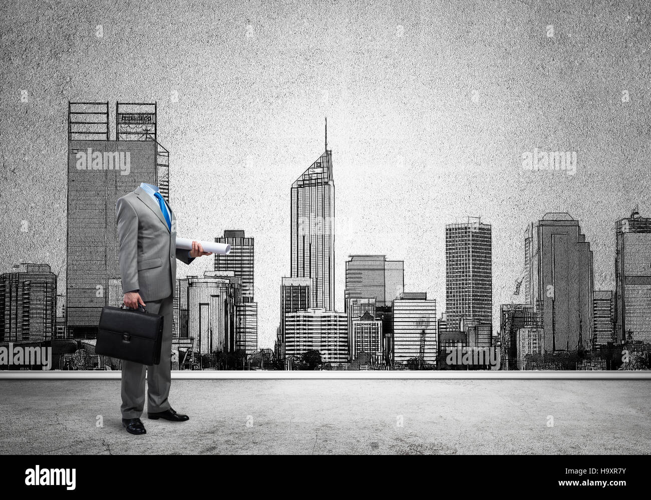 Headless engineer man with papers in hand against construction ...