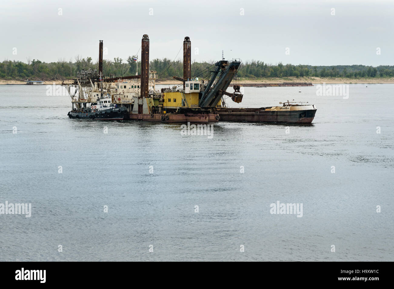Dredging platform and cargo ship on Volga river. Volgograd, Russia ...