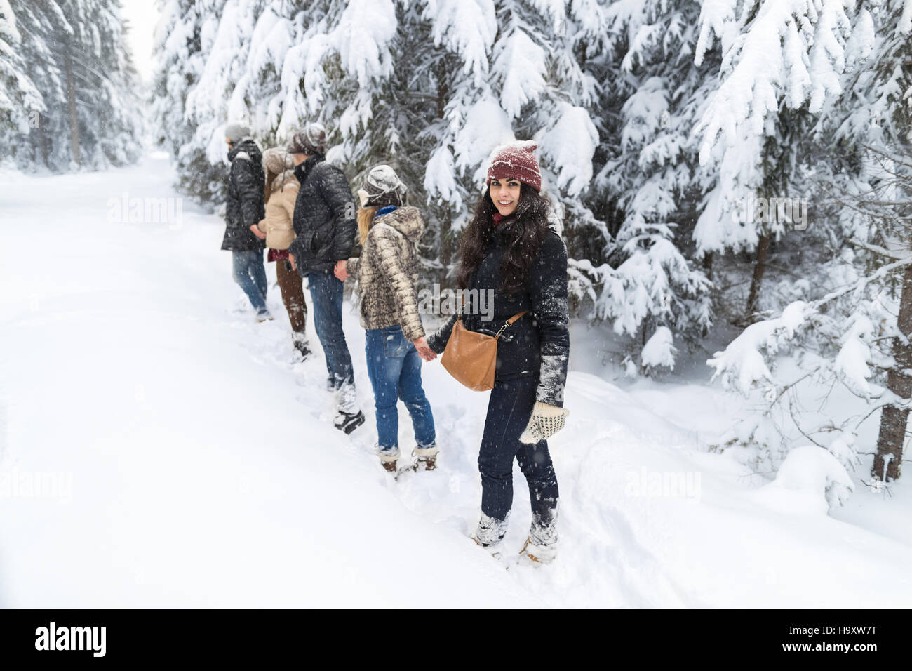 Friends Group Snow Forest Young People Walking Outdoor Stock Photo - Alamy