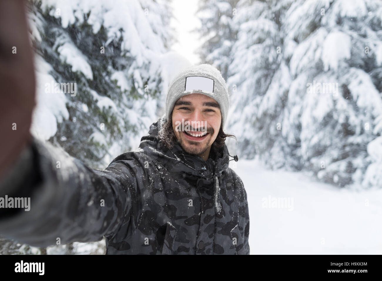 Young Man Smile Camera Taking Selfie Photo In Winter Snow Forest Guy ...