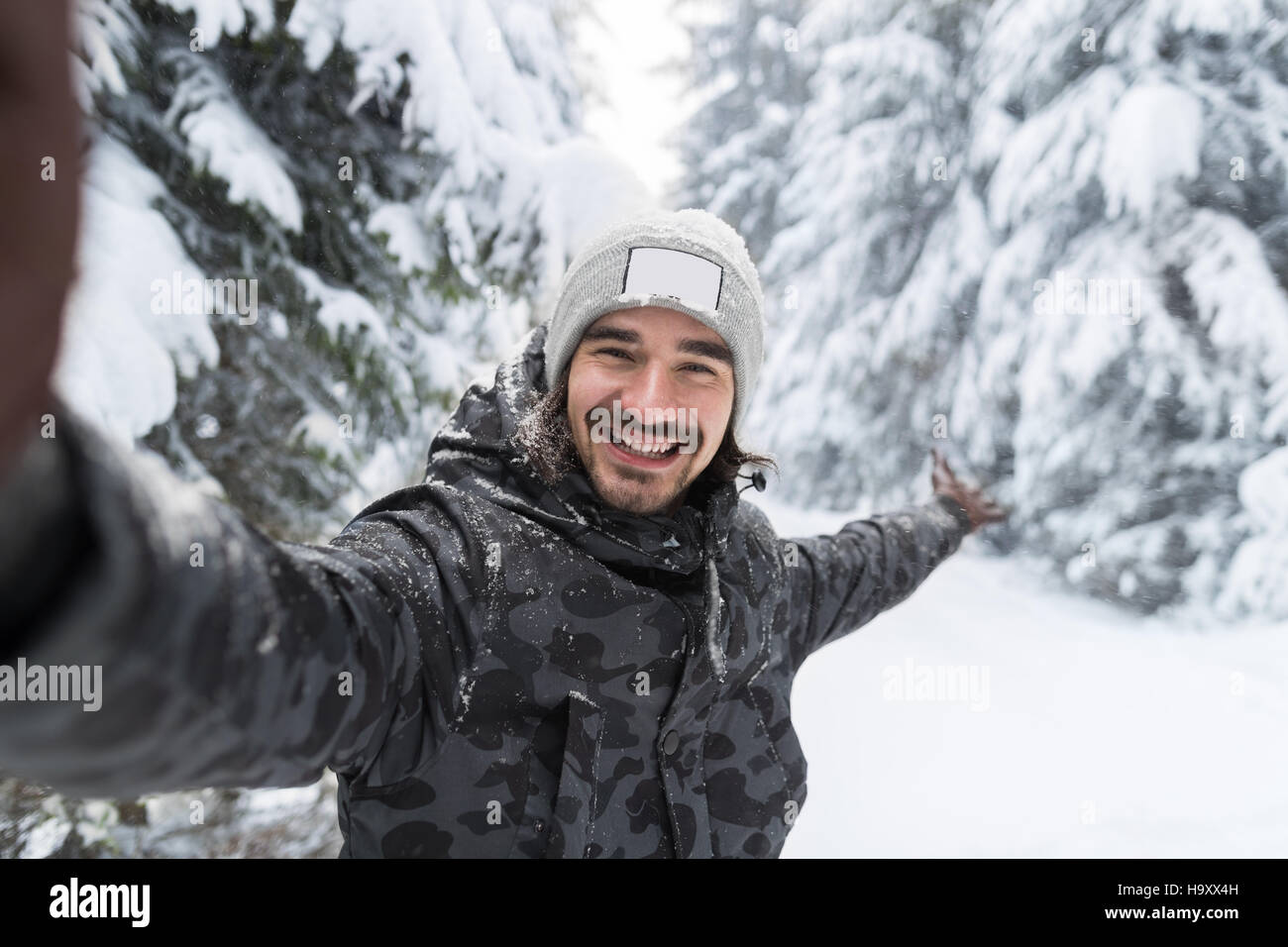 Young Man Smile Camera Taking Selfie Photo In Winter Snow Forest Guy ...