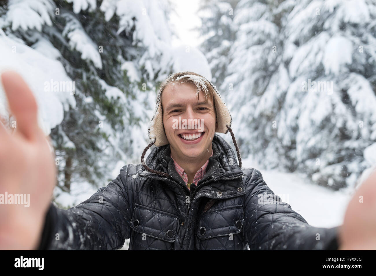 Young Man Smile Camera Taking Selfie Photo In Winter Snow Forest Guy ...