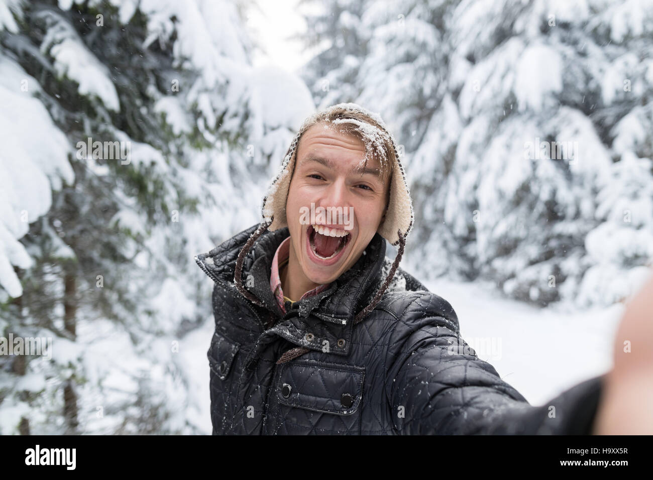 Young Man Smile Camera Taking Selfie Photo In Winter Snow Forest Guy ...