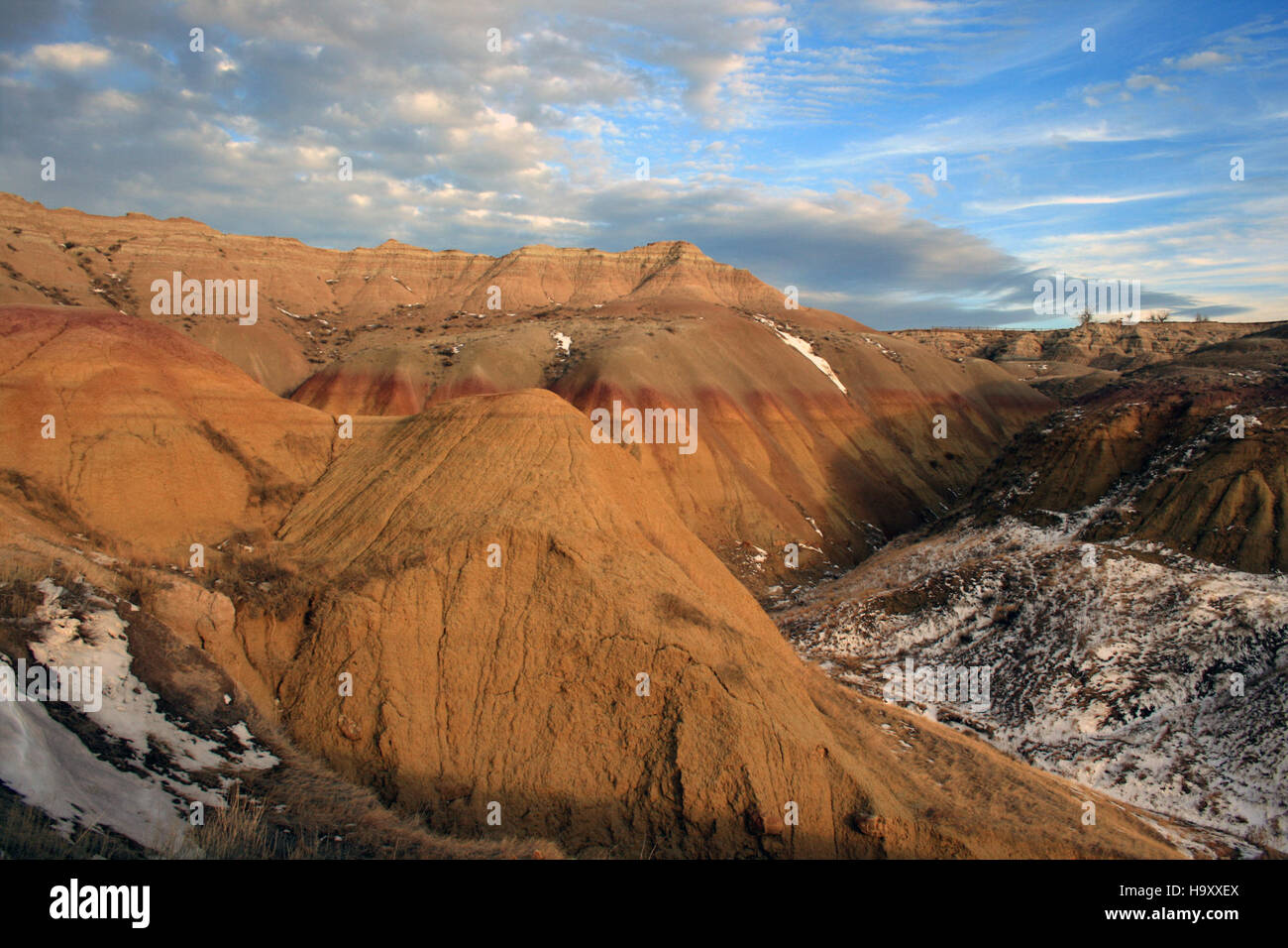 A breathtaking sunset casts a warm light over the Yellow Mounds ...