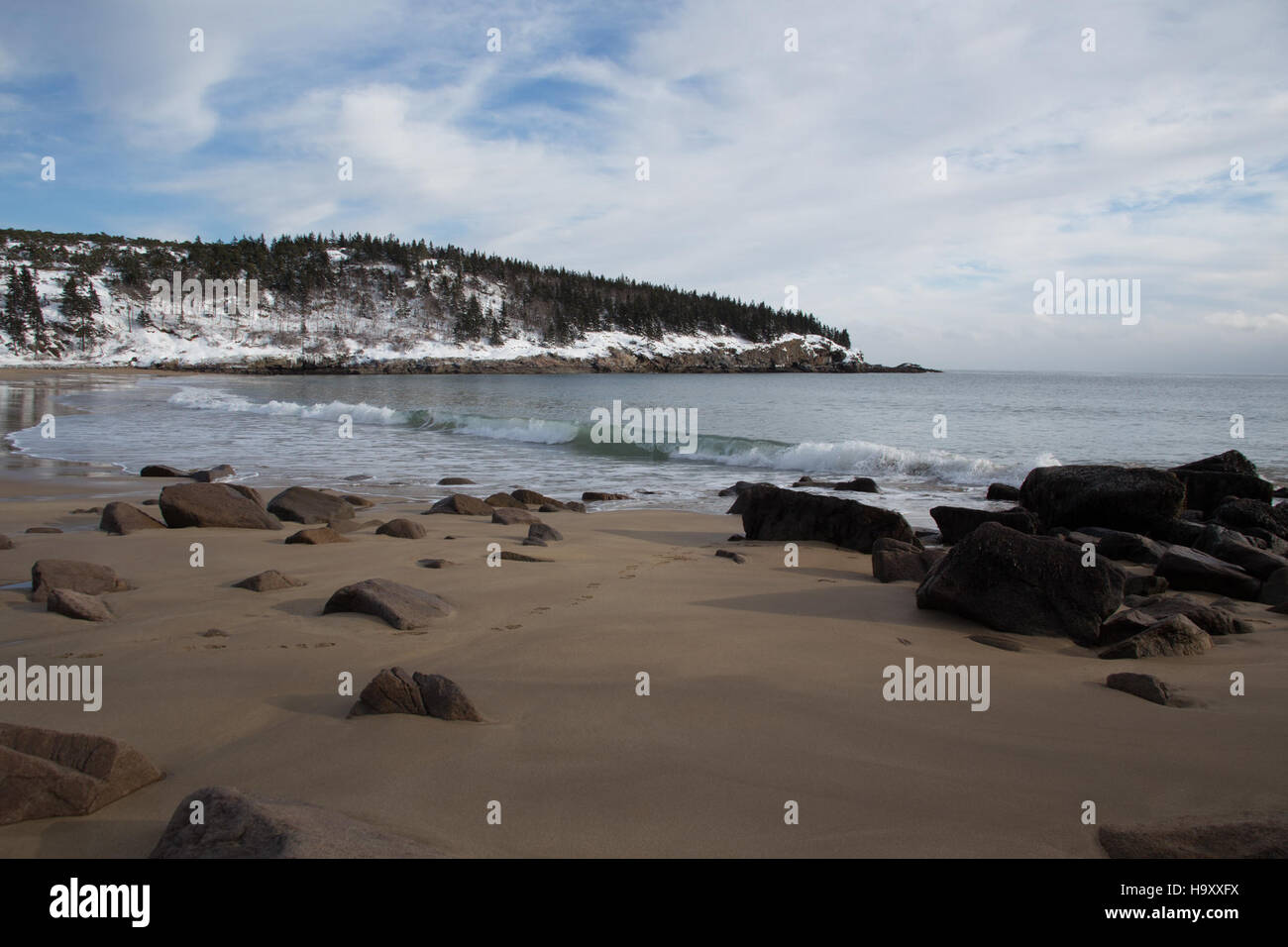 A winter scene at Sand Beach on Ocean Drive in Acadia National Park ...