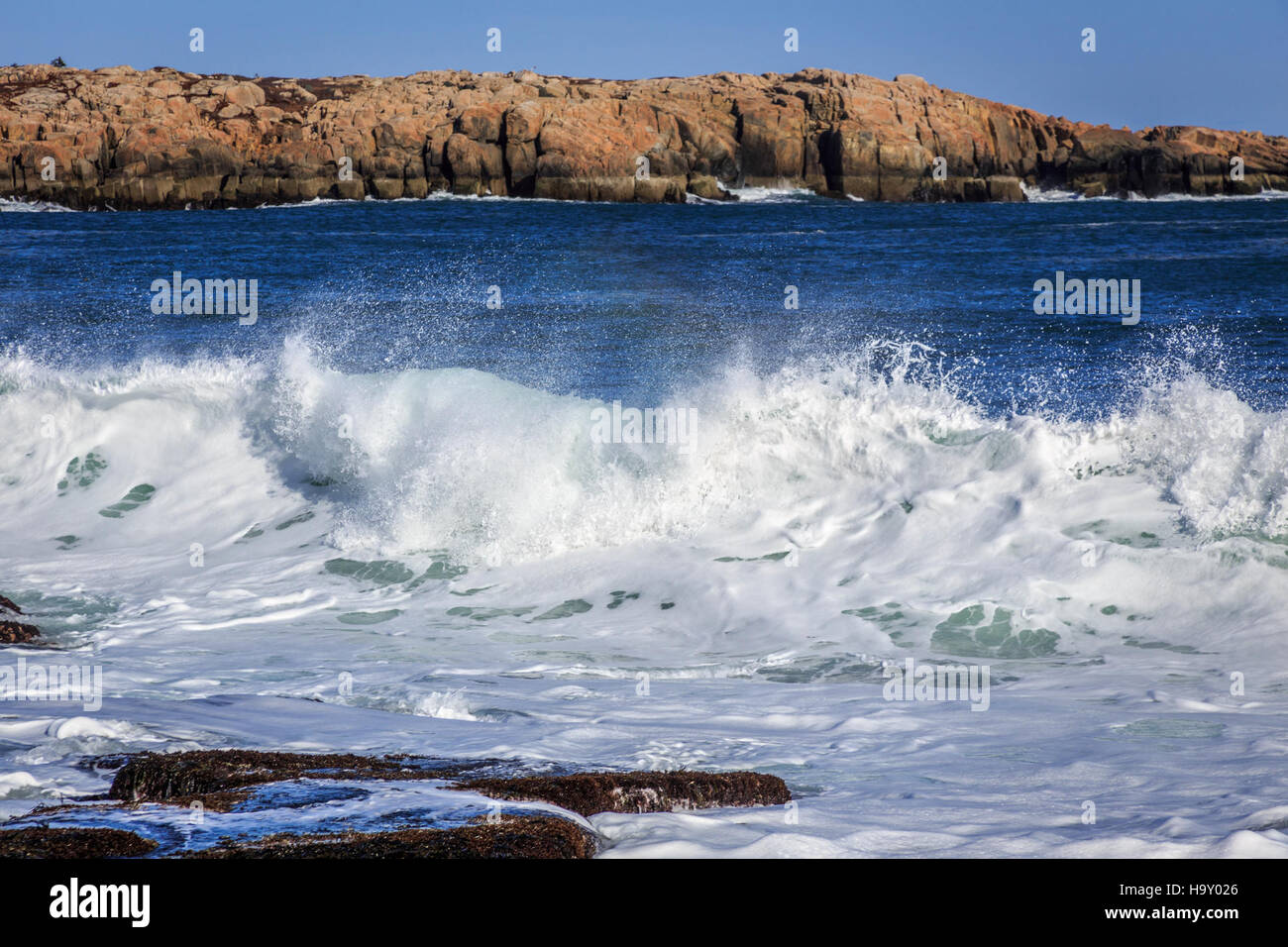This image captures the dynamic movement of crashing waves ...