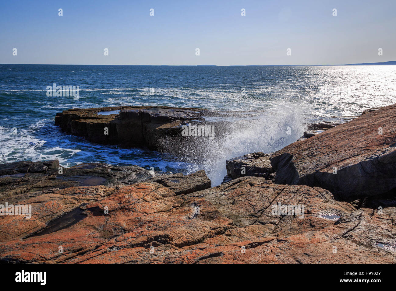 This dramatic image captures crashing waves on a rugged coastline ...