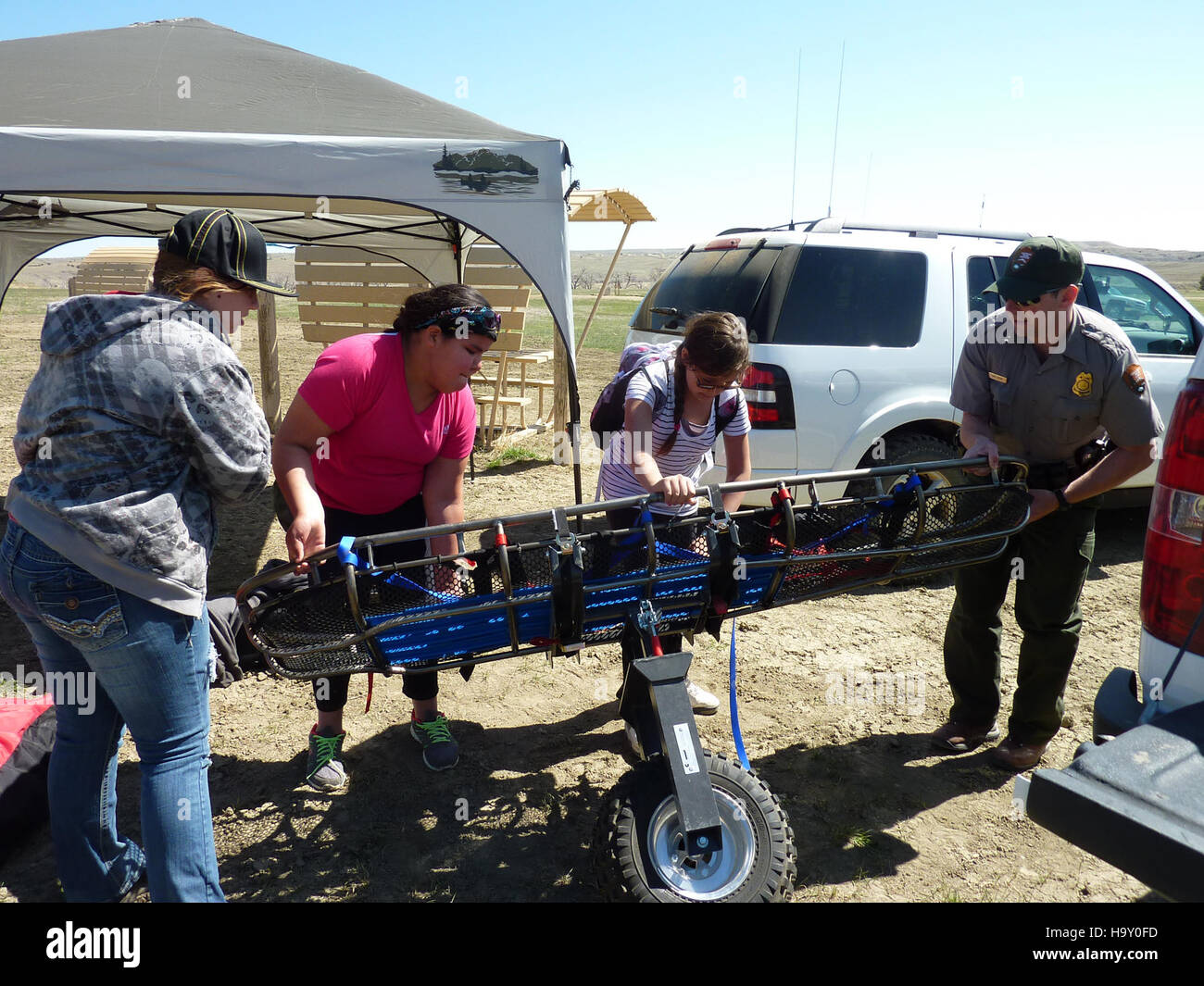 Interior School students set up a wheeled litter while learning about ...