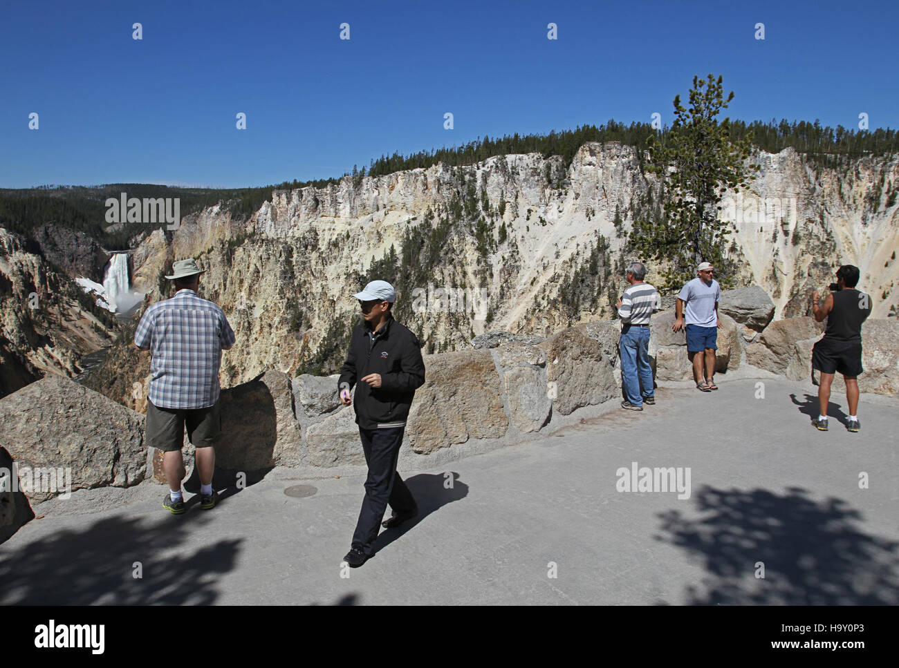Visitors enjoy the breathtaking view of the Lower Falls in the Grand ...
