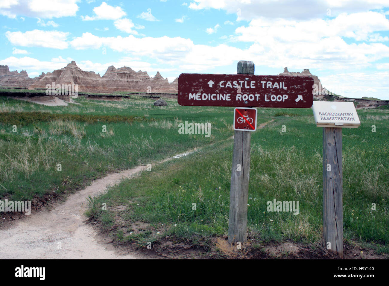 A sign at the junction of Castle and Medicine Root Trails in Badlands ...