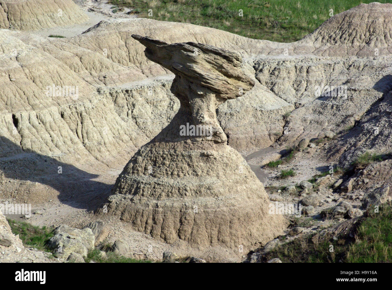 Toadstool Rock at Norbeck Pass in Badlands National Park is a prominent ...