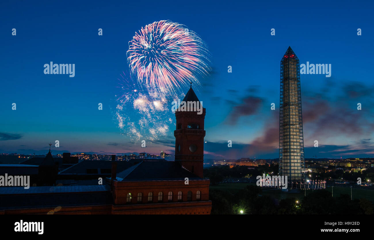 A photo showing the Yates Building with scaffolding as fireworks light ...