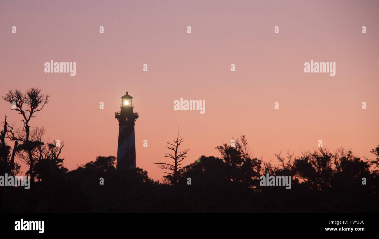 The dawn light over Hatteras Island highlights the iconic Hatteras ...