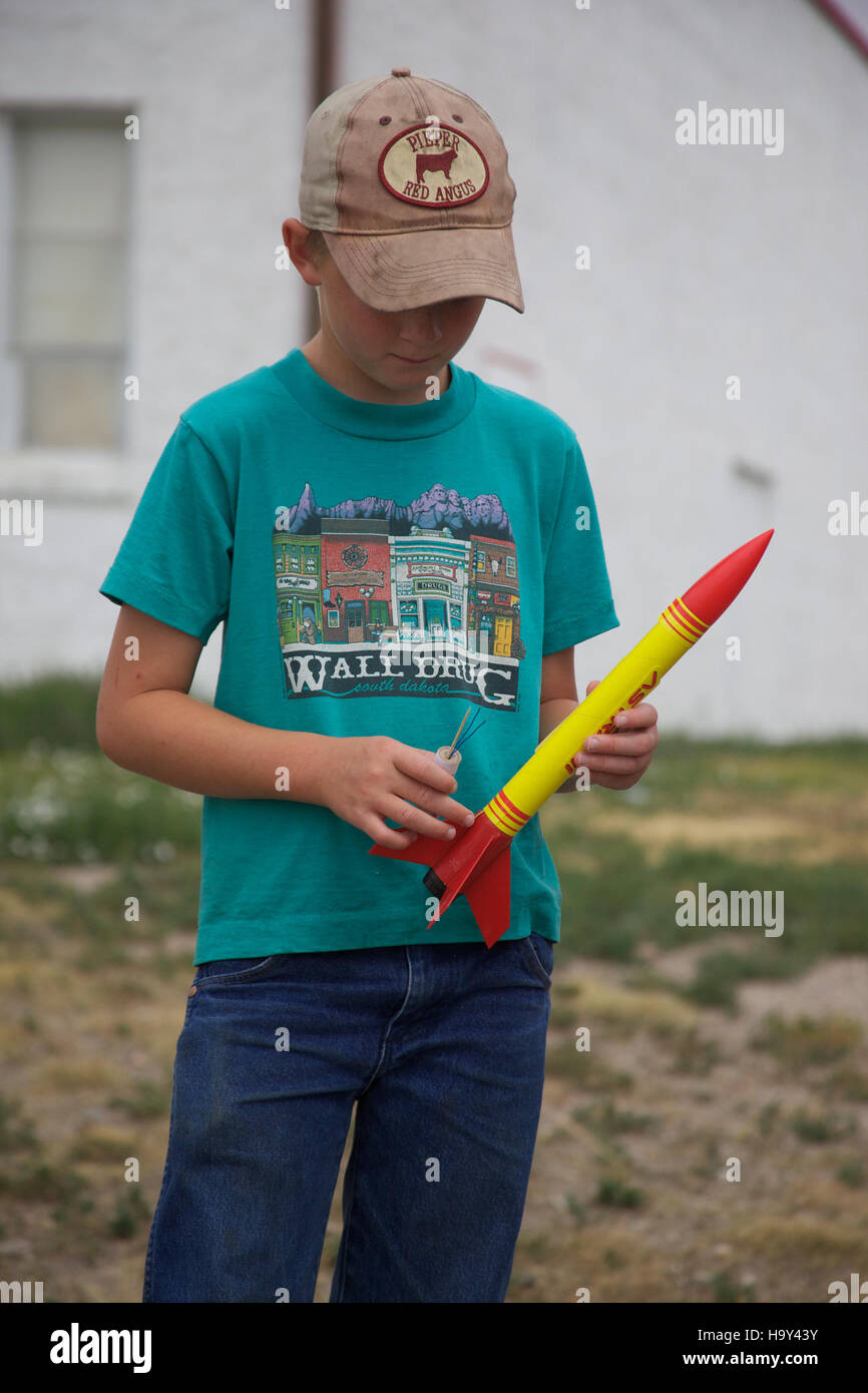 A boy prepares to launch a model rocket at Badlands National Park ...