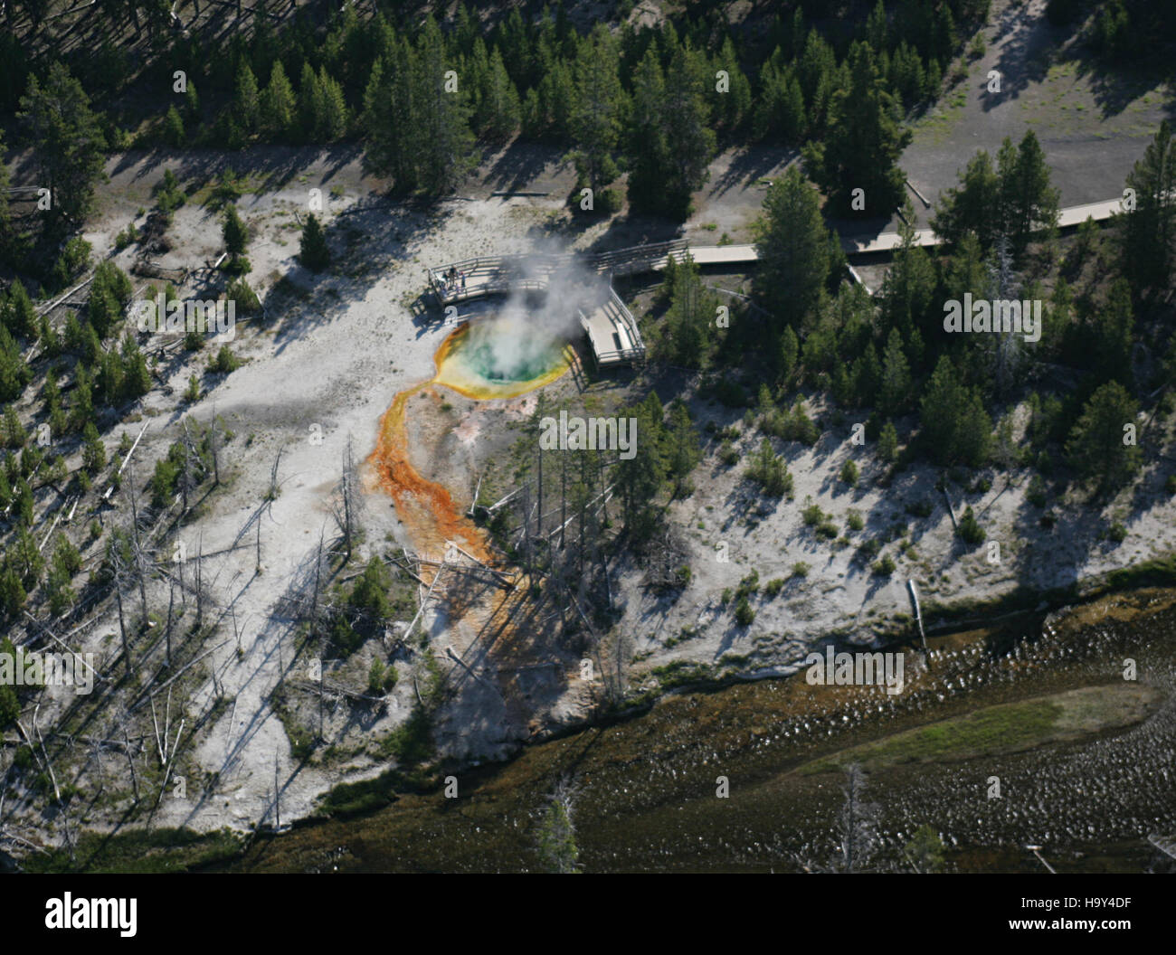 Morning Glory Pool, located in Yellowstone National Park, is a ...